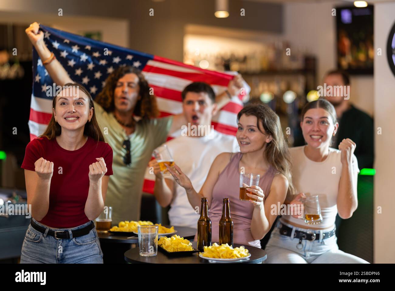 Group of fans in bar with US flag Stock Photo - Alamy