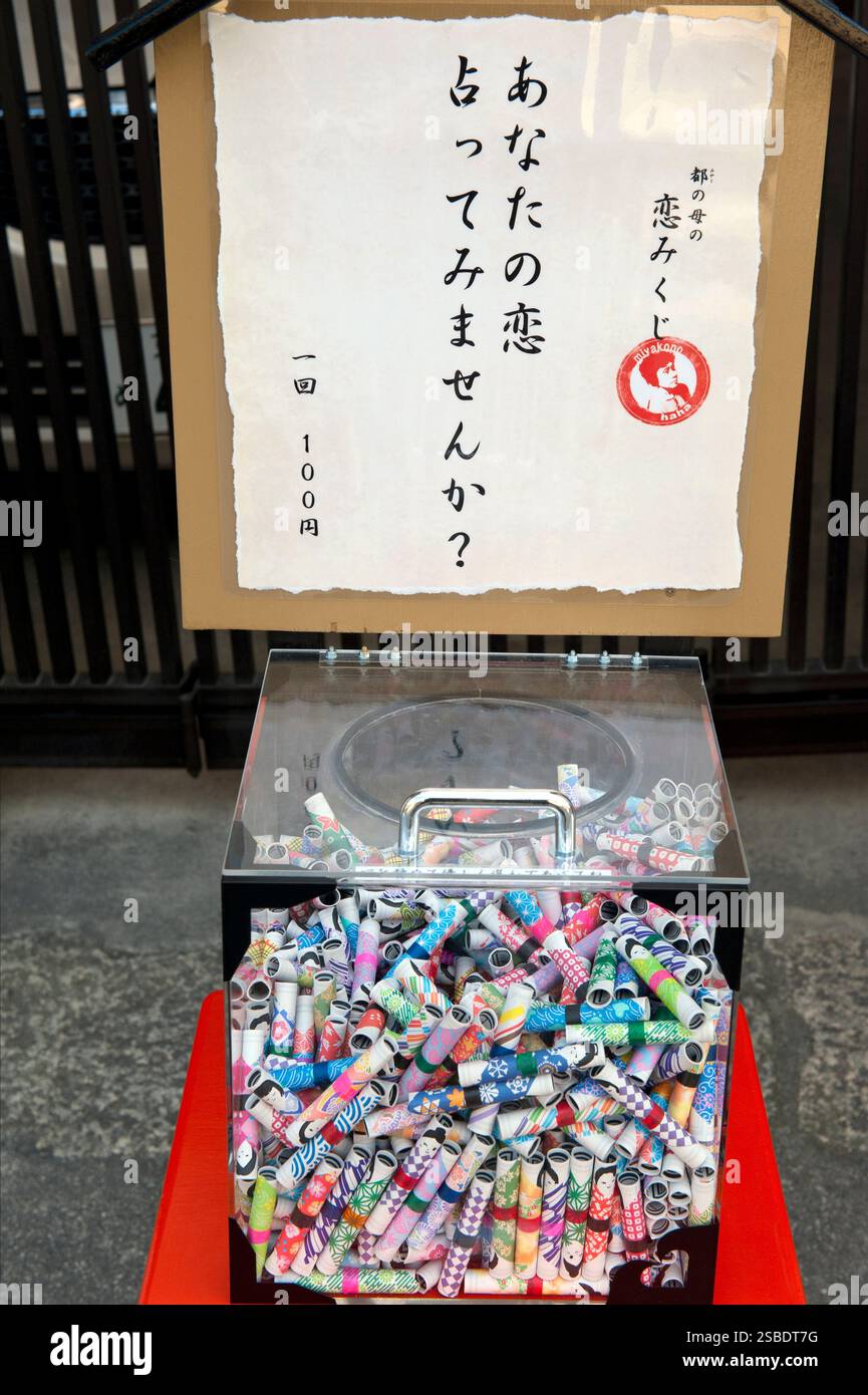 Omikuji style kiosk container of colorful paper rolls for 100 Yen ...