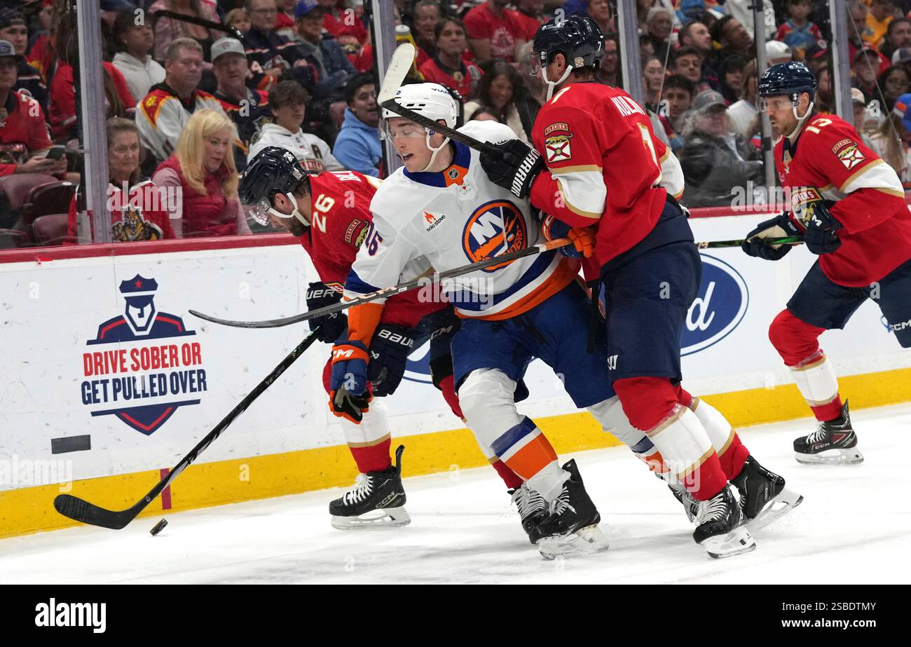 New York Islanders center Marc Gatcomb (16) goes for the puck against ...