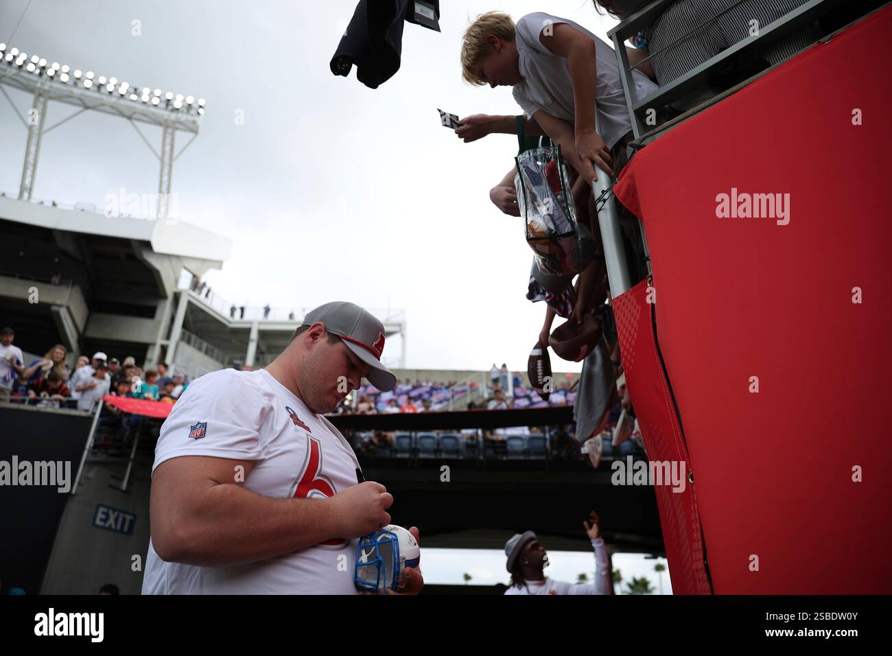 Players sign autographs for fans before the NFL Pro Bowl Game on Sunday ...