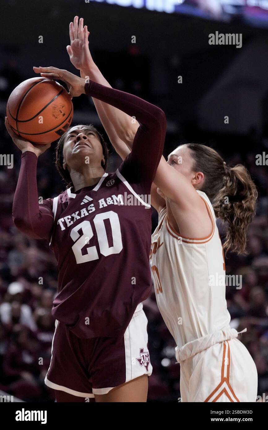 Texas A&M guard Janae Kent (20) tries to shoot around Texas guard Shay ...