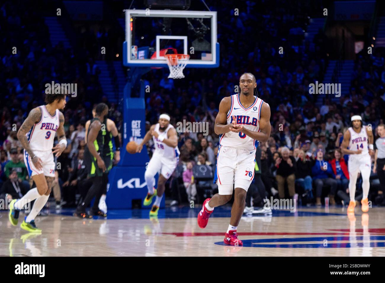 Philadelphia 76ers' Tyrese Maxey, center right, reacts after his 3 ...