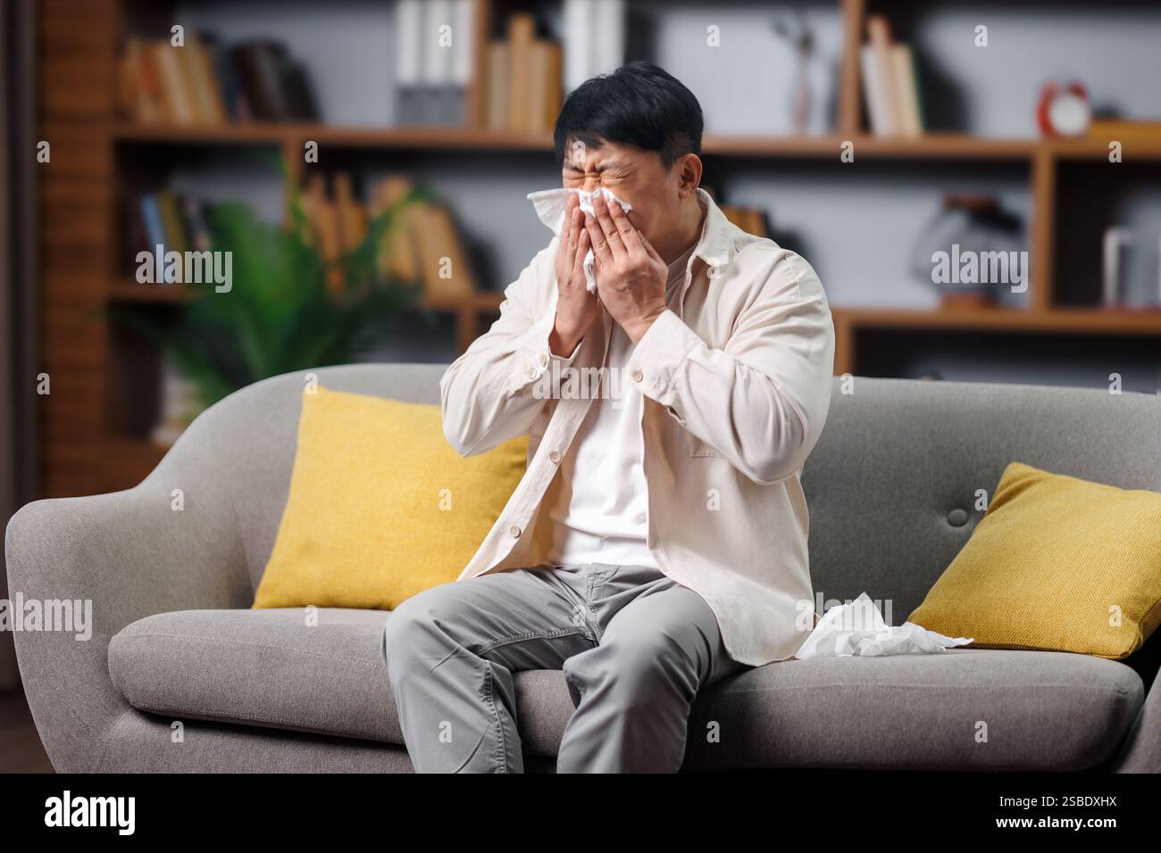 ill sick man, feeling unwell, having headache, asian man expressing ...