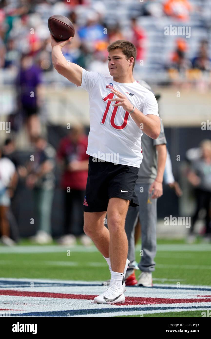 AFC quarterback Drake Maye (10), of the New England Patriots, warms up ...