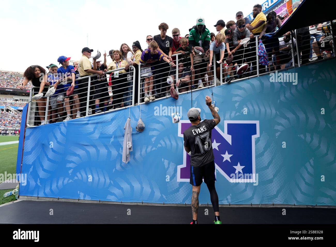 NFC wide receiver Mike Evans (13), of the Tampa Bay Buccaneers, signs autographs after the flag ...