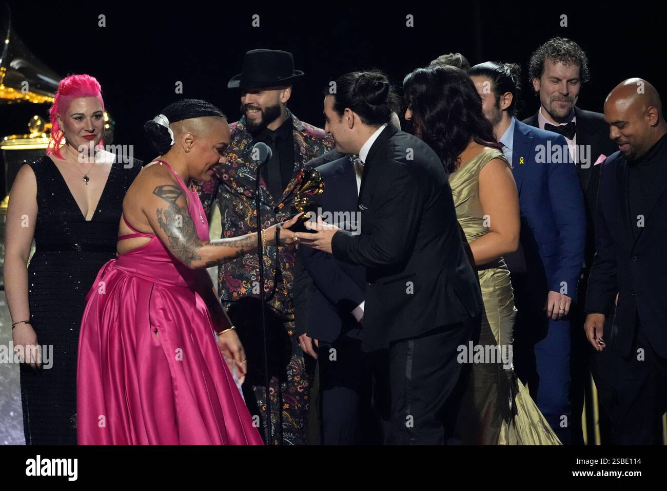 Queen Sheba, left, presents Dan Pugach Big Band with the award for best ...