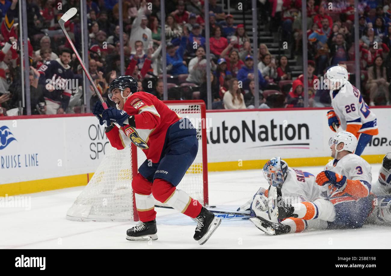Florida Panthers center Evan Rodrigues, left, reacts after scoring ...