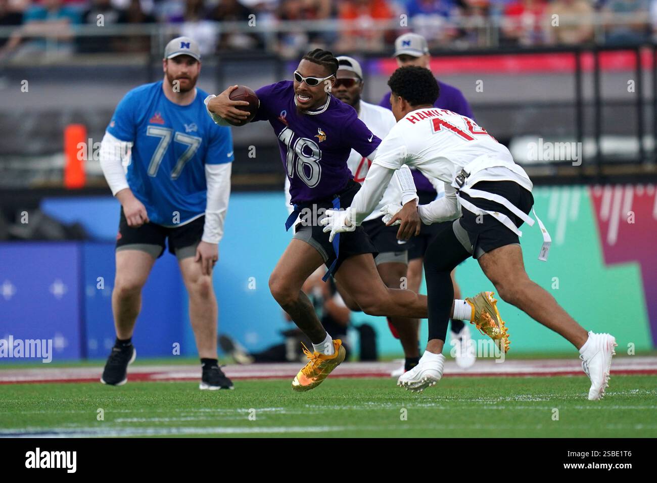 NFC wide receiver Justin Jefferson (18), of the Minnesota Vikings, carries the ball during the ...