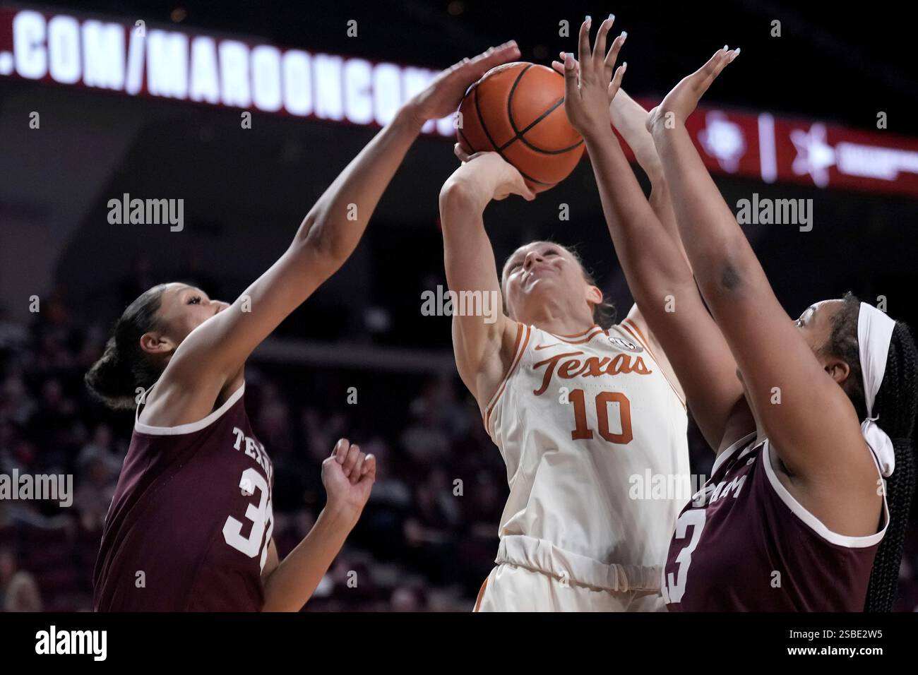 Texas guard Shay Holle (10) has her shot blocked by Texas A&M forward ...