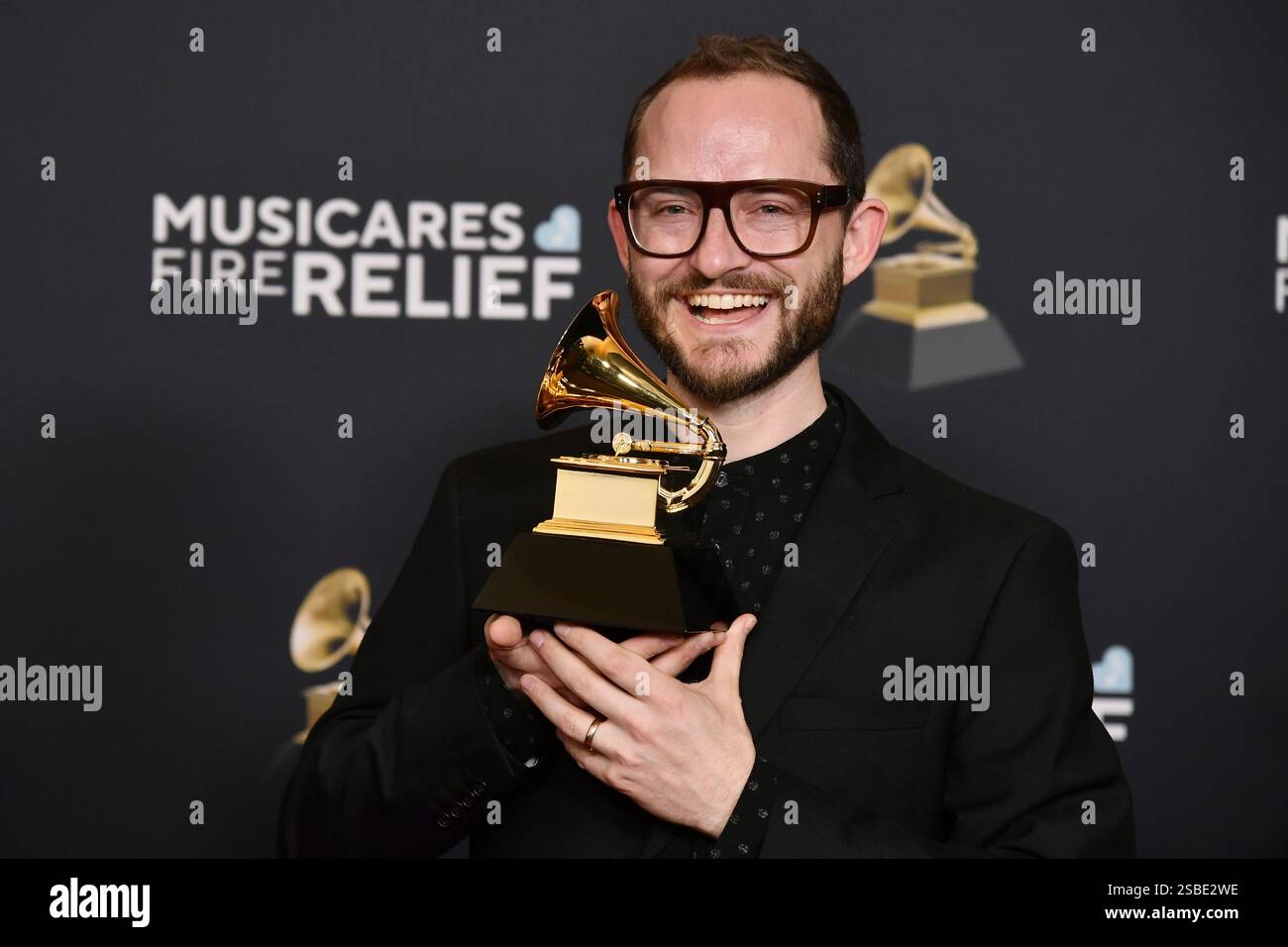 Pascal Le Boeuf poses in the press room with the award for best ...