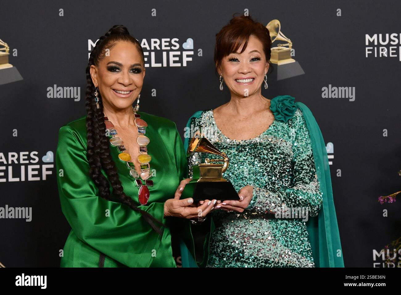 Sheila E., left, and Mimy Succar pose in the press room with the award for best global music ...