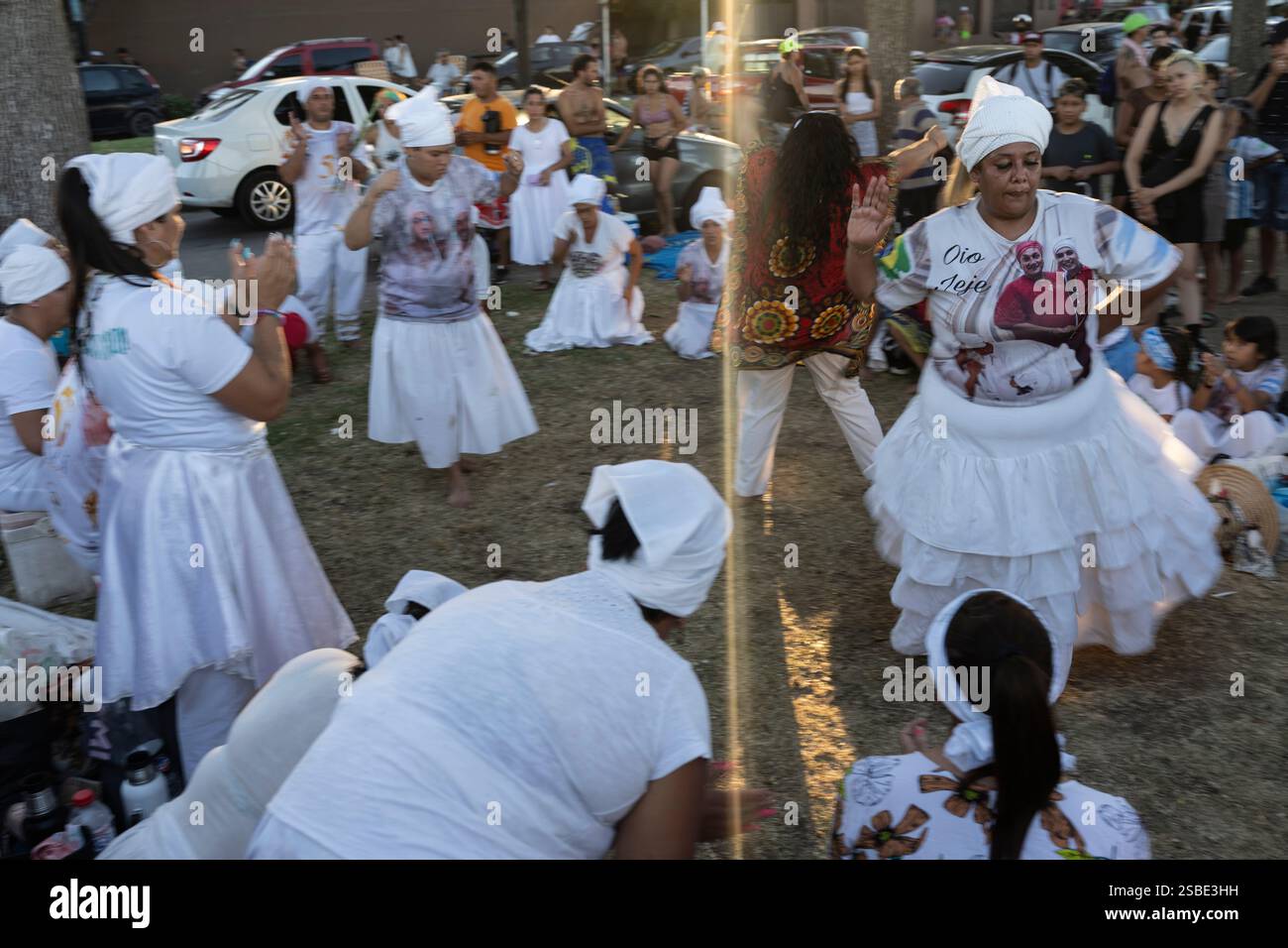 Devotees dance during a ceremony honoring Yemanja, an African goddess ...