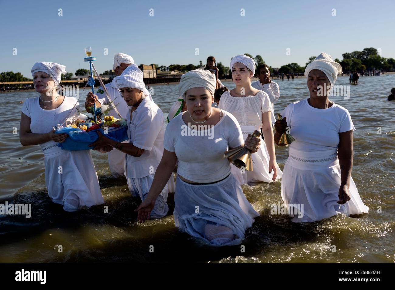 Devotees take part in a ceremony honoring Yemanja, an African goddess ...
