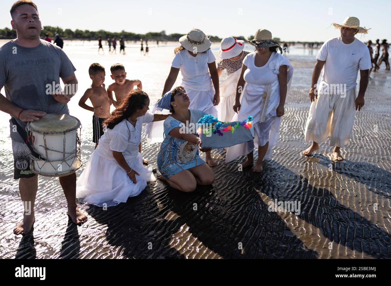 Devotees take part in a ceremony honoring Yemanja, an African goddess ...
