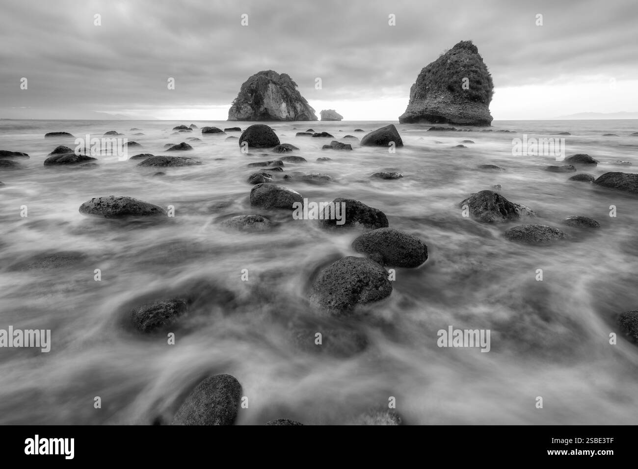 A Wide Angle Closeup Of A Wave Rolling To Shore Flowing Over Sea Rocks ...