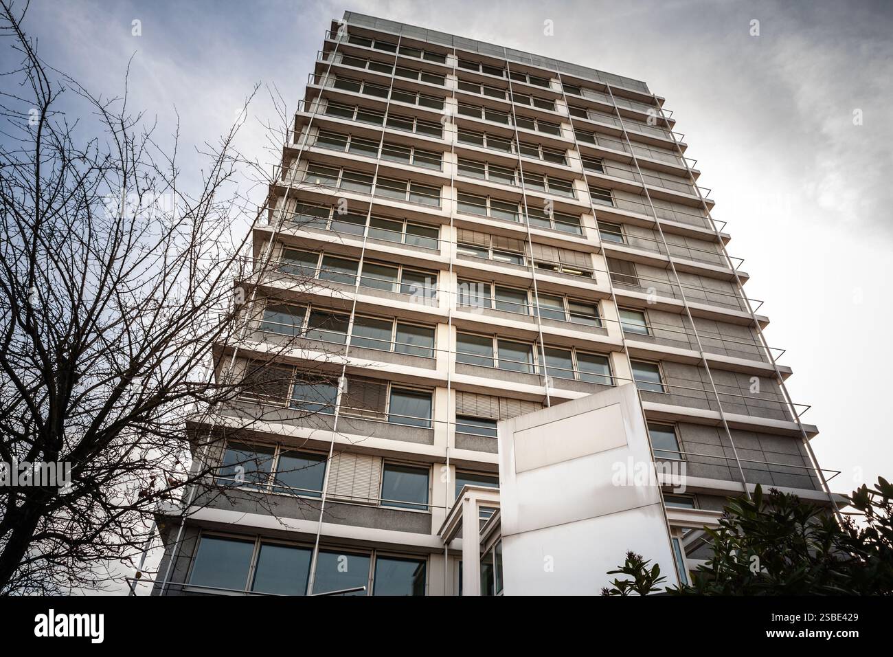A multistory office tower from the 1970s rises above the surrounding ...