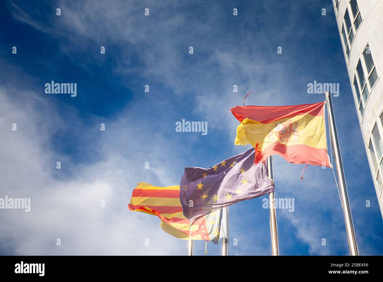 Three flags—Spain, the European Union, and Comunidad Valenciana—flutter ...