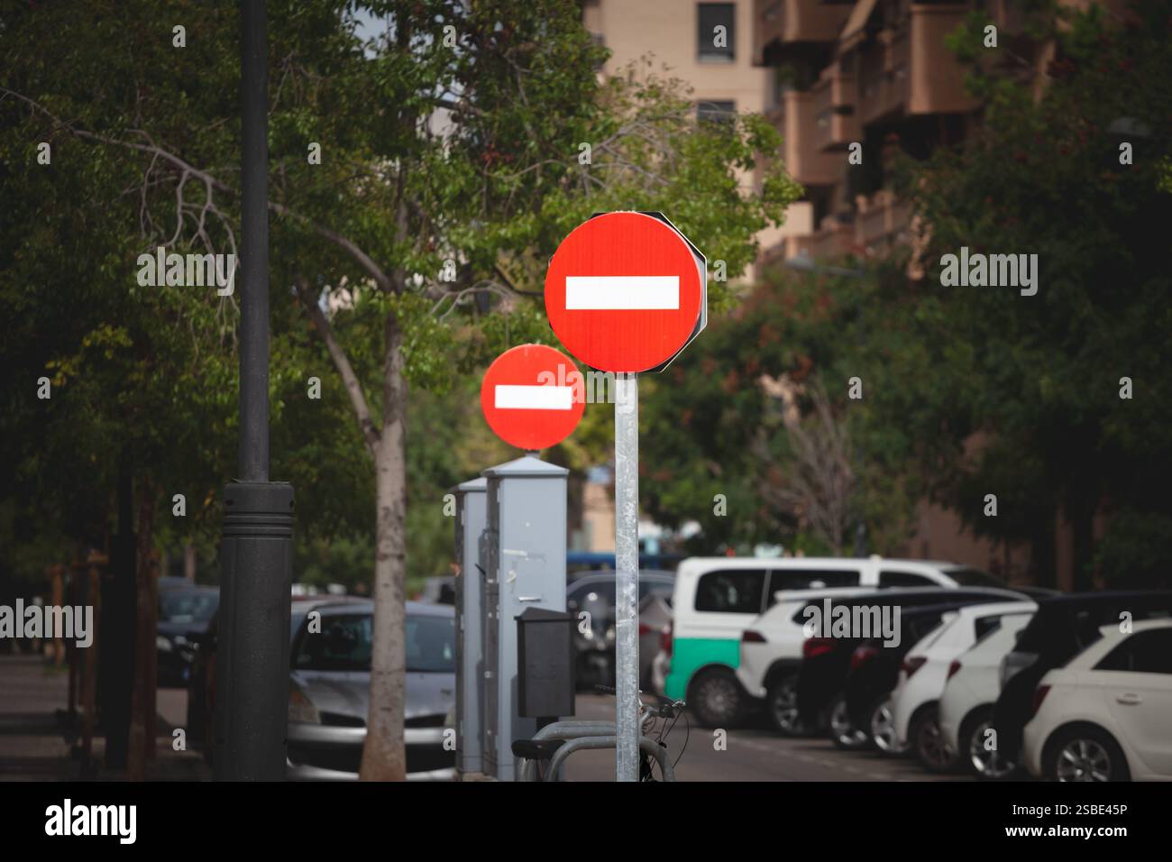 Selective blur on a bright red no-entry sign signals a wrong way on ...