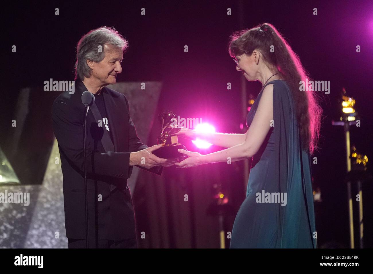 Bob Clearmountain, left, presents Winifred Phillips with the award for ...