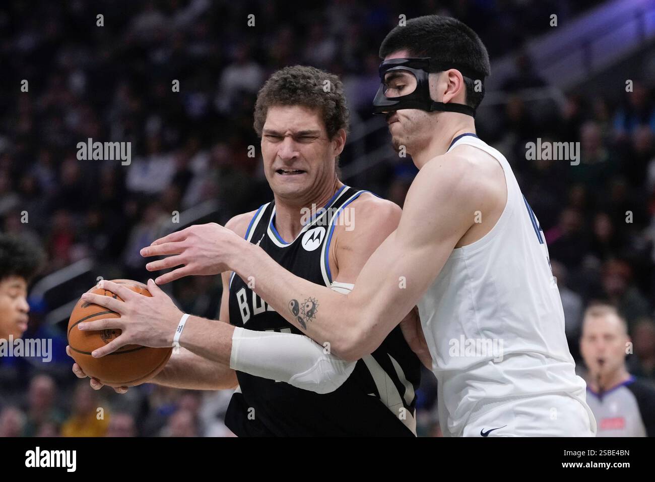Milwaukee Bucks' Brook Lopez tries to get past Memphis Grizzlies' Zach ...