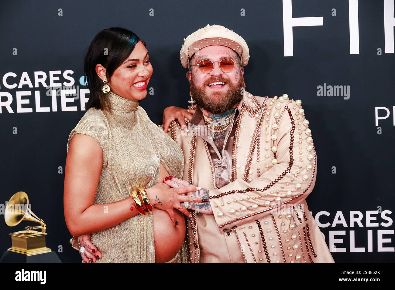 Raiche and Teddy Swims walking on the red carpet during the 67th Grammy ...
