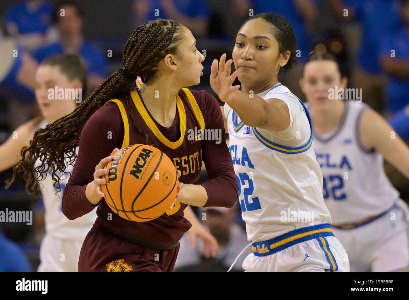 UCLA forward Kendall Dudley (22) guards Minnesota guard Amaya Battle ...