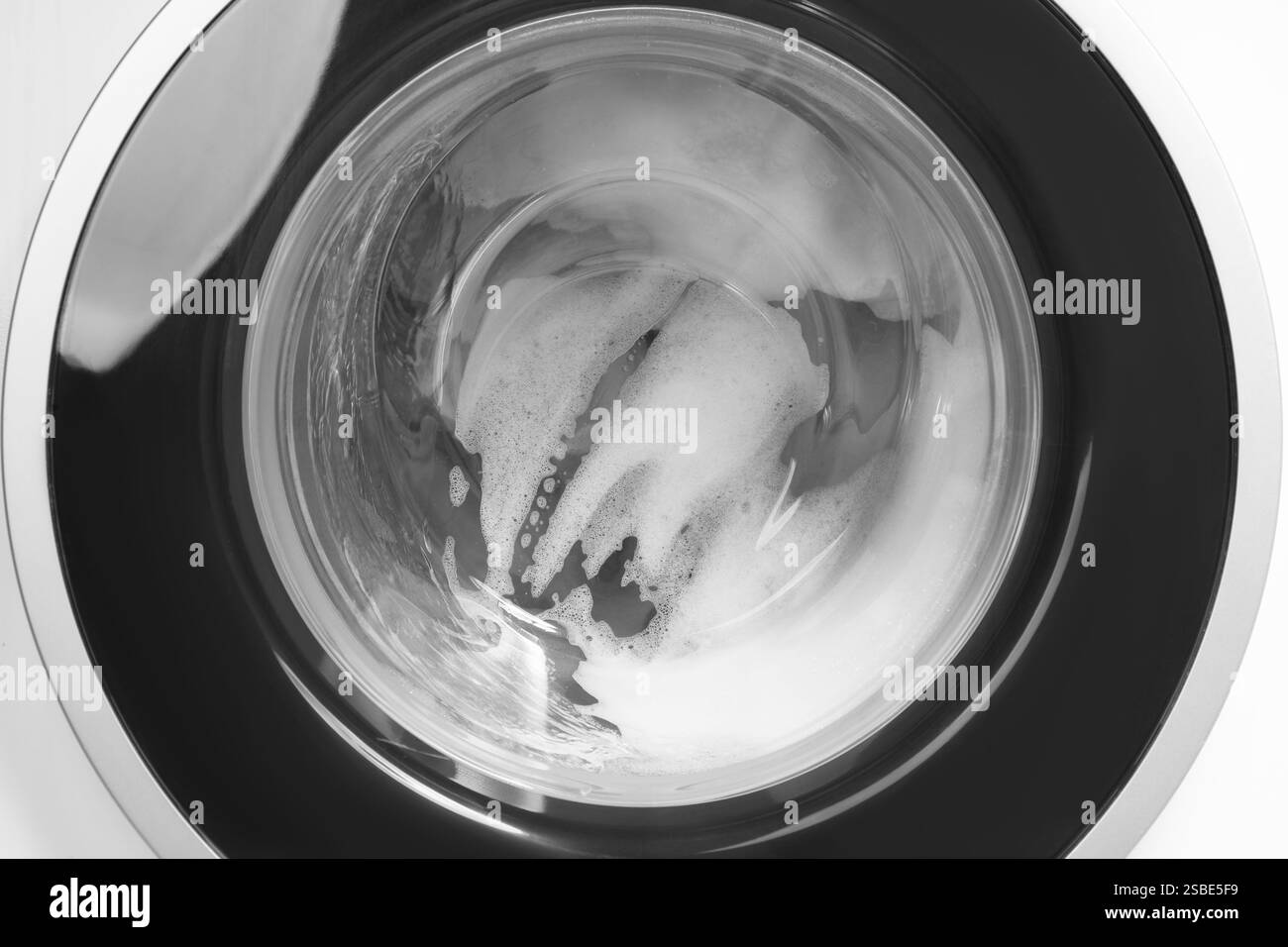 Washing machine with suds as background, closeup Stock Photo - Alamy
