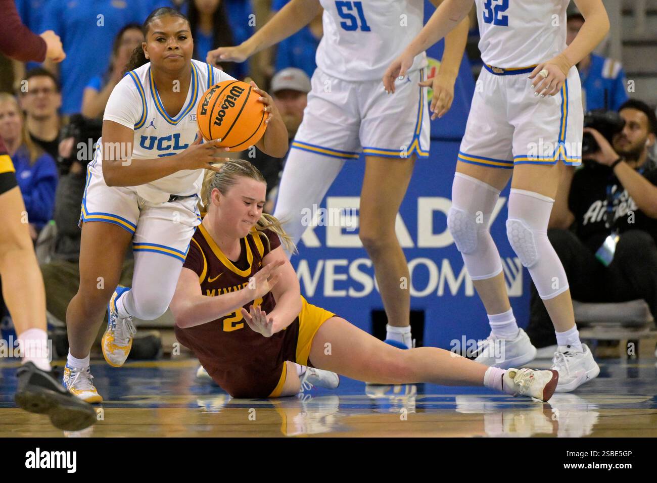 UCLA guard Londynn Jones, left, steals the all from Minnesota forward ...
