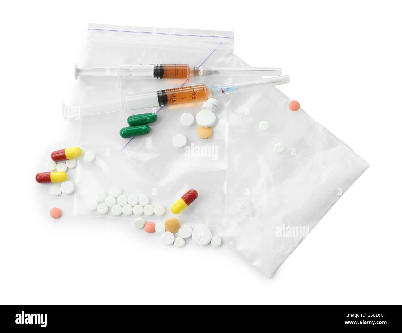 Drug addiction. Different pills, plastic bags with powder and syringes ...
