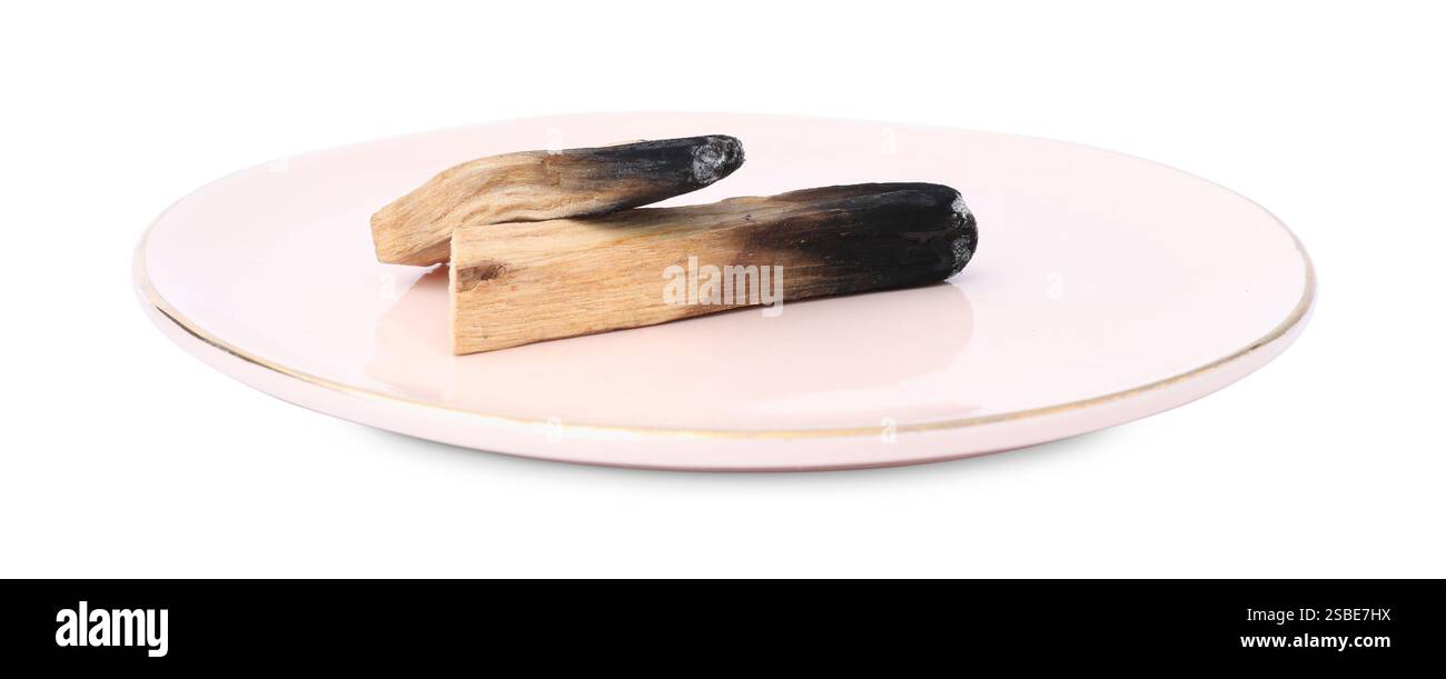 Burnt palo santo sticks on white background Stock Photo - Alamy