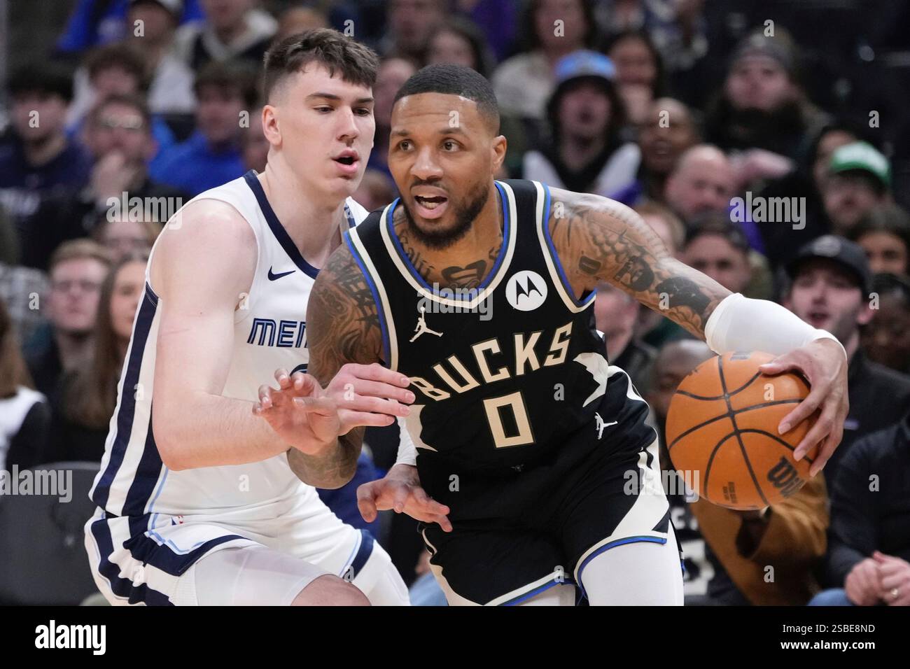 Milwaukee Bucks' Damian Lillard drives past Memphis Grizzlies' Jake ...