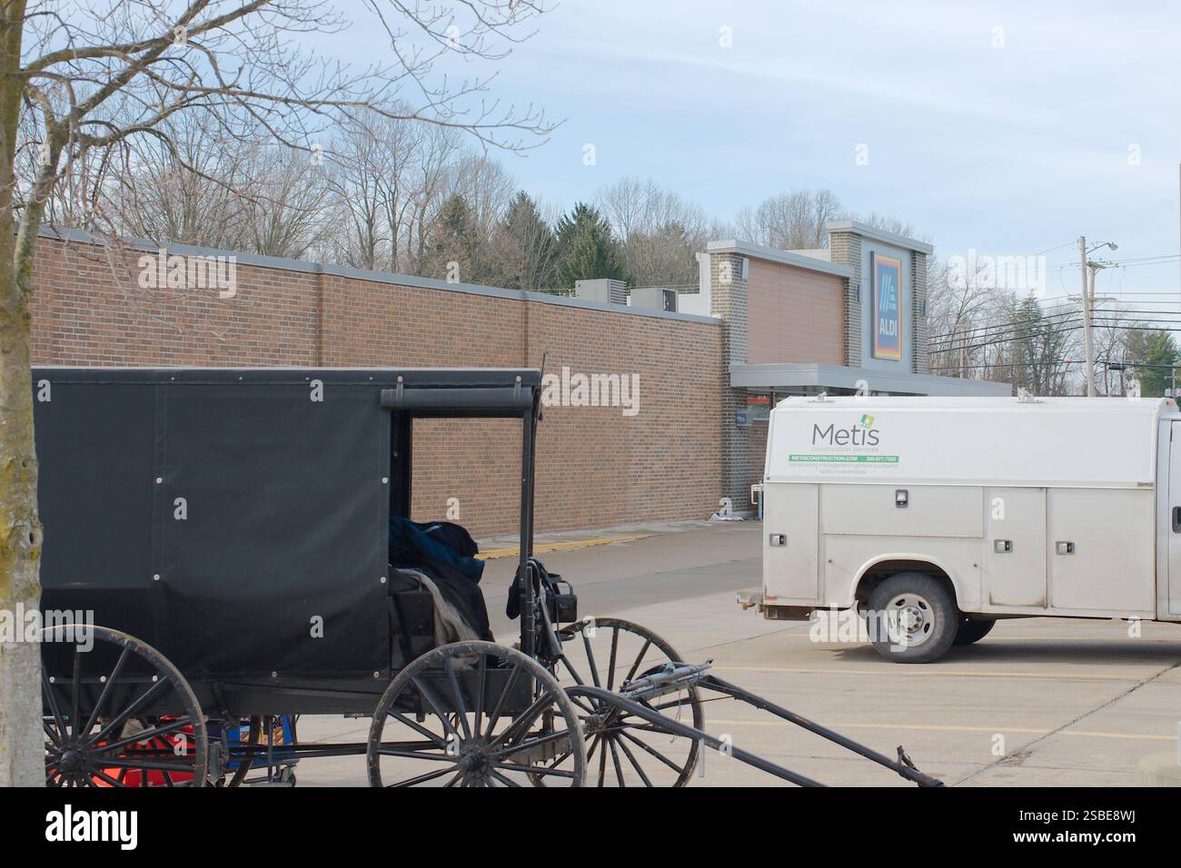 Black Amish buggy no horse in parking lot of an Aldi Grocery store ...