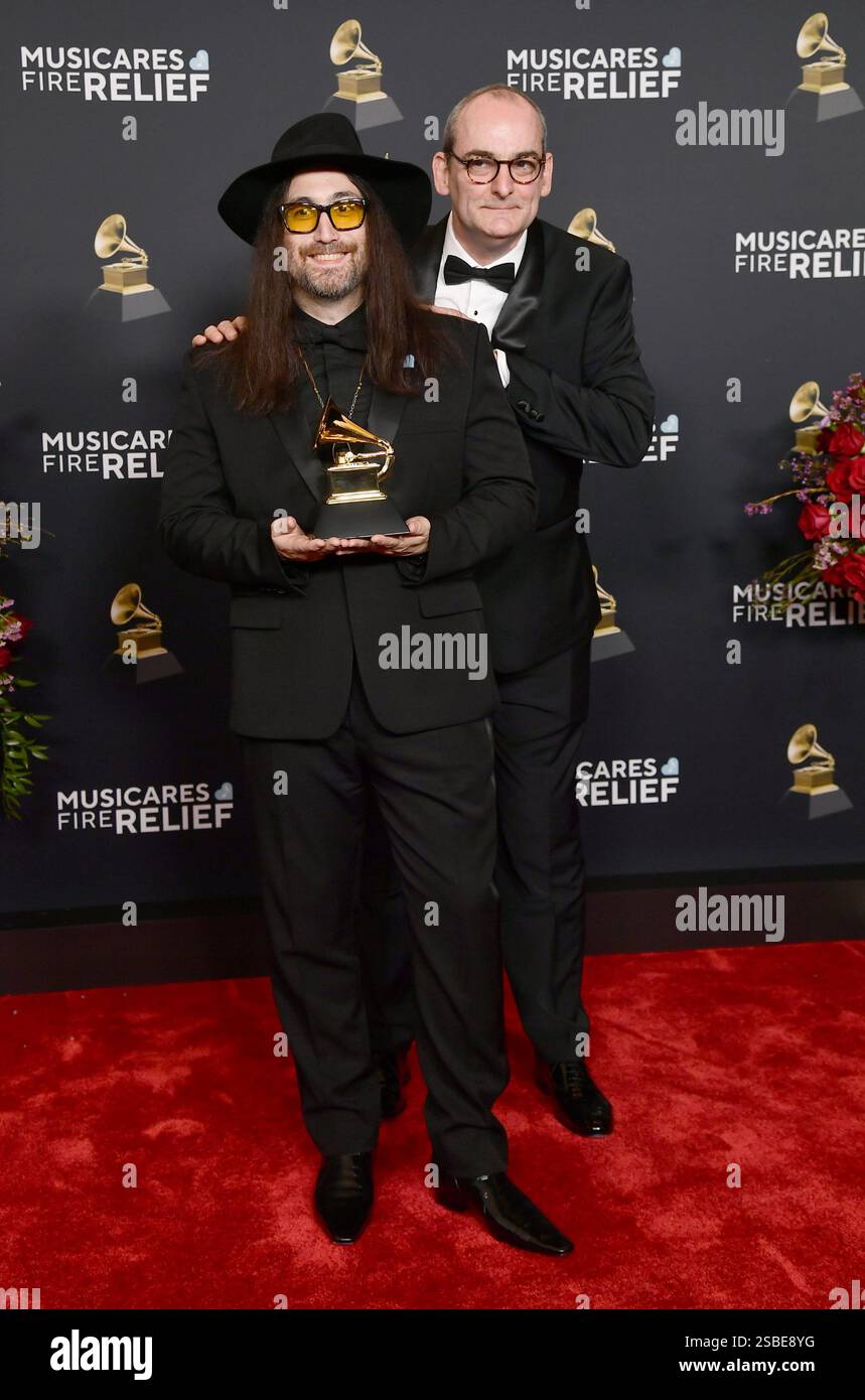 Sean Lennon, left, Simon Hilton pose in the press room with the award ...