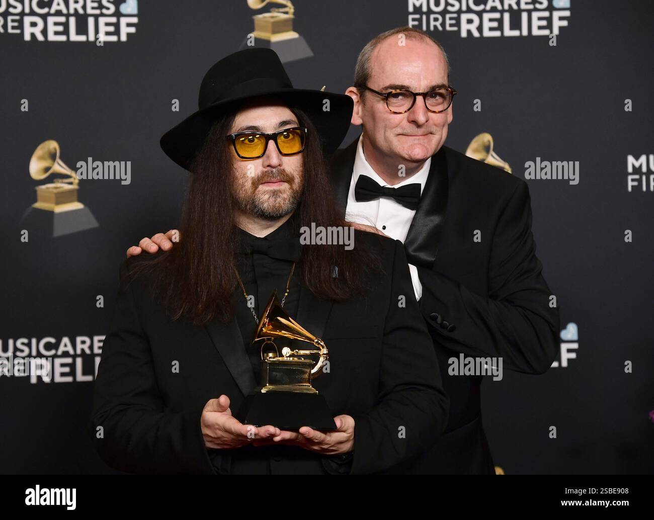 Sean Lennon, left, Simon Hilton pose in the press room with the award ...
