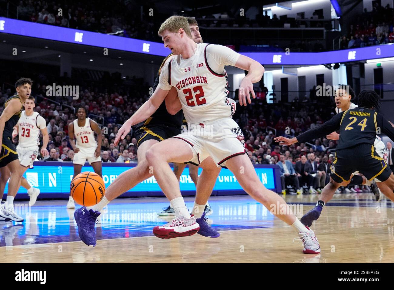 Wisconsin forward Steven Crowl (22) and Northwestern center Matthew ...