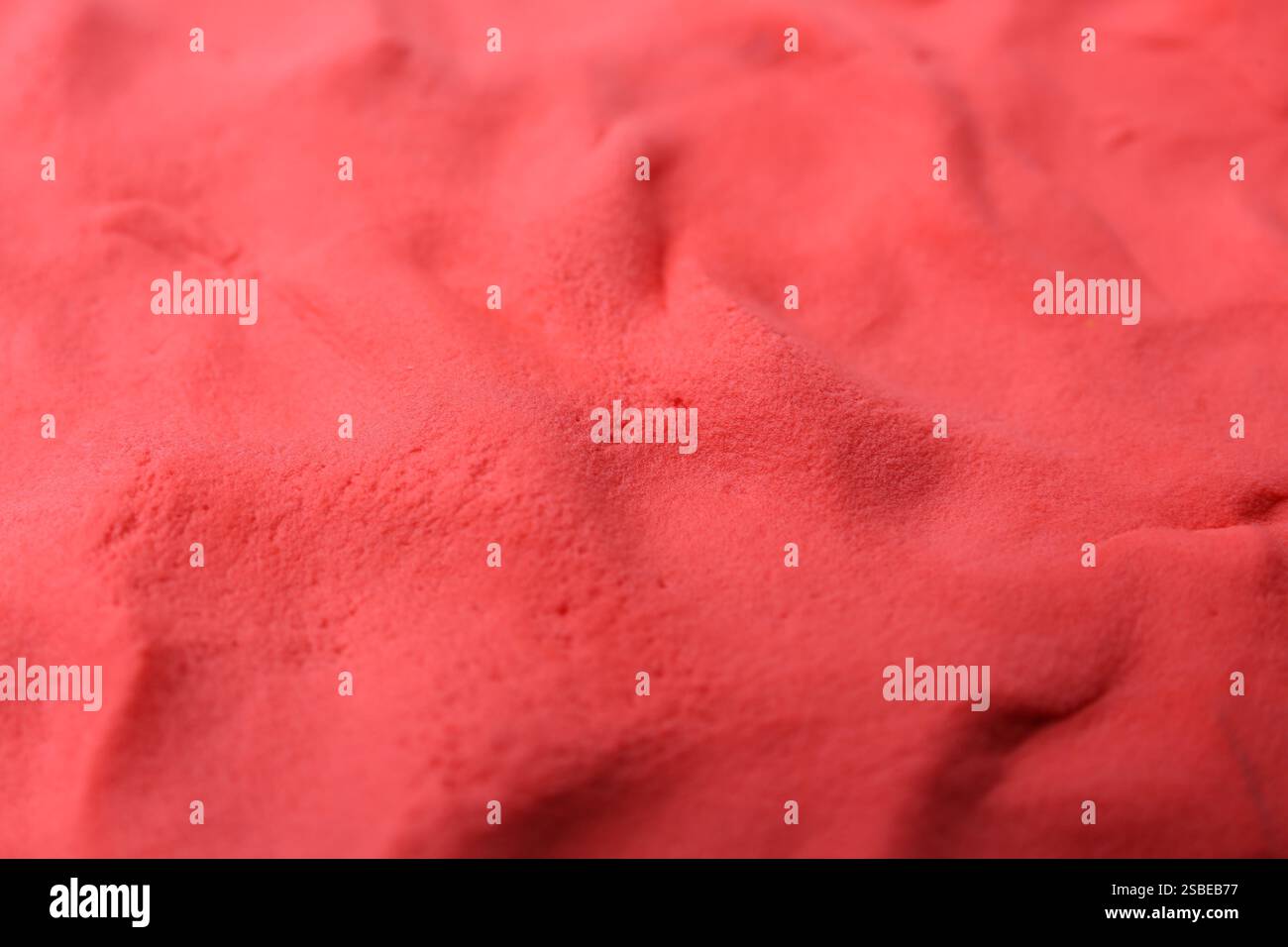 Bright red play dough as background, closeup Stock Photo - Alamy