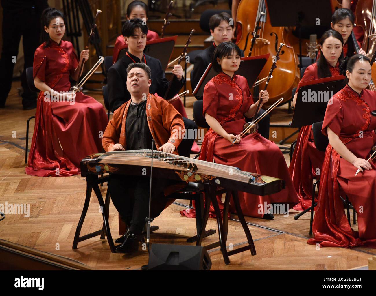 Vienna, Austria. 2nd Feb, 2025. Wang Zhongshan (front) performs guzheng ...