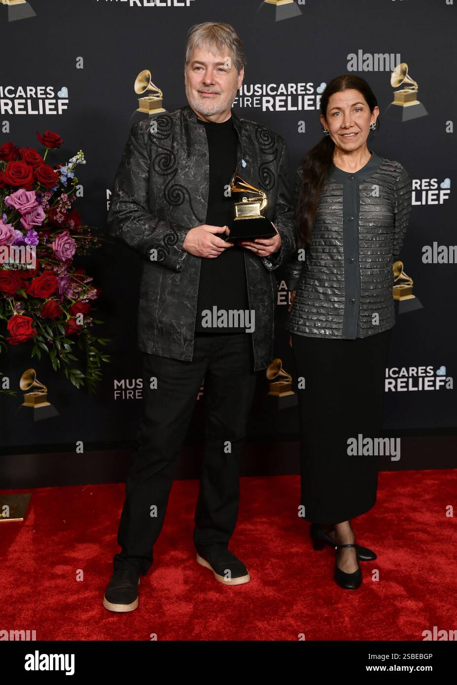 Bela Fleck, left, and Liana Corea pose in the press room after ...