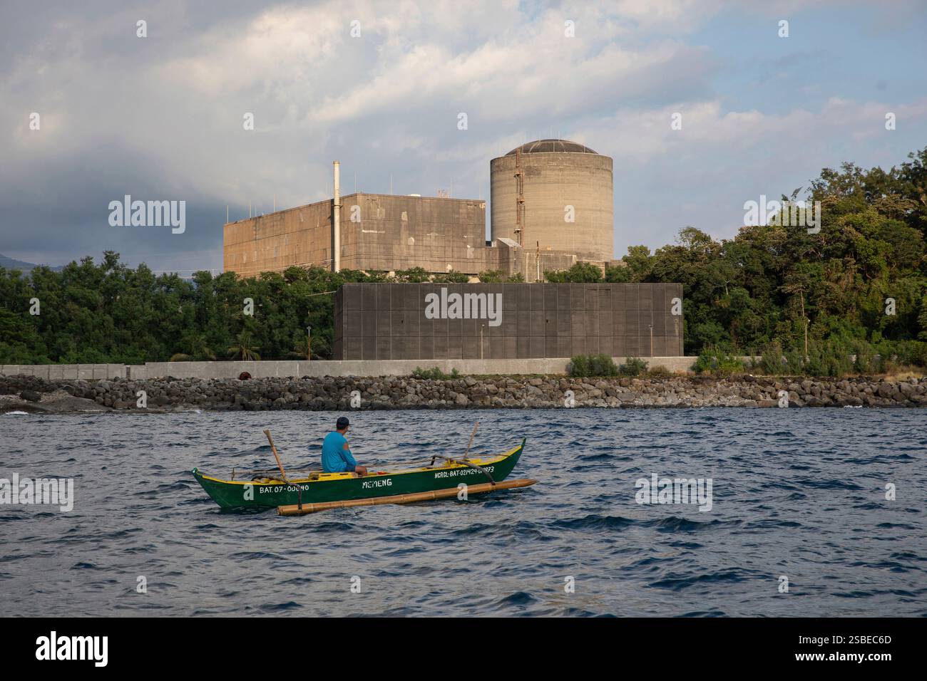 A fisherman tries to catch fish in the waters of the West Philippine ...