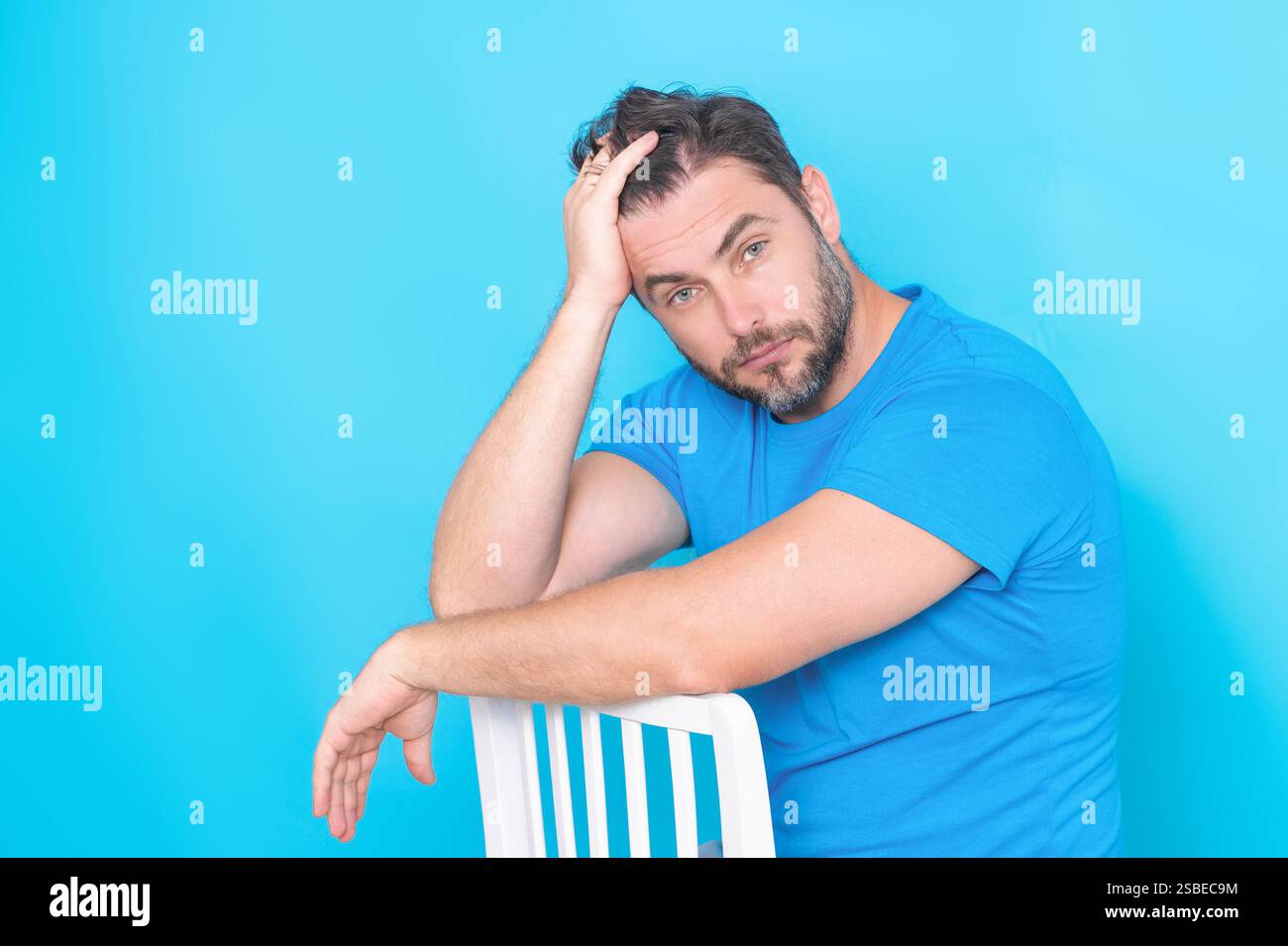 Stressed lonely man holding his head, feeling anxious. Man experiencing ...