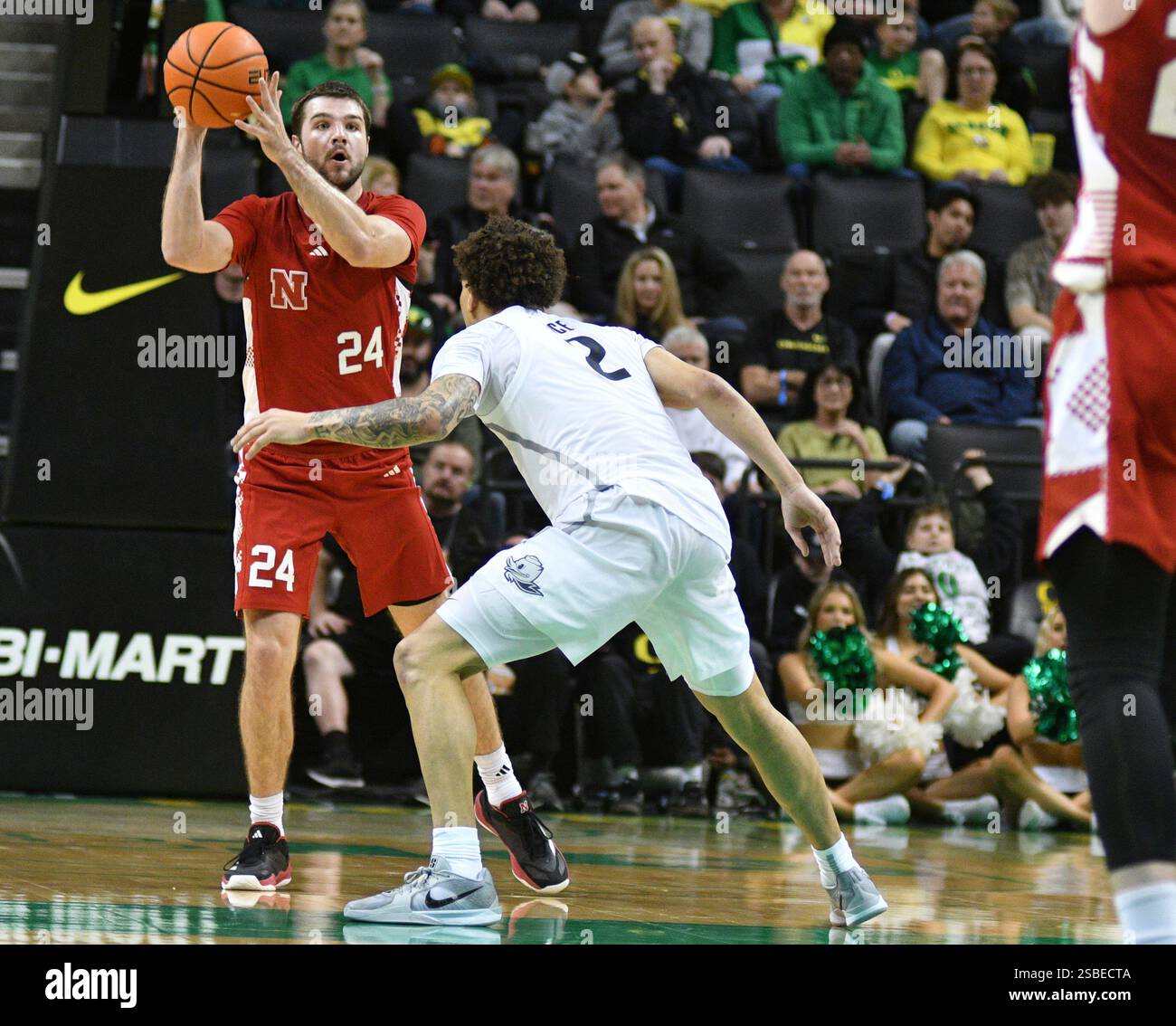Nebraska guard Rollie Worster (24) passes over Oregon guard Jadrian ...