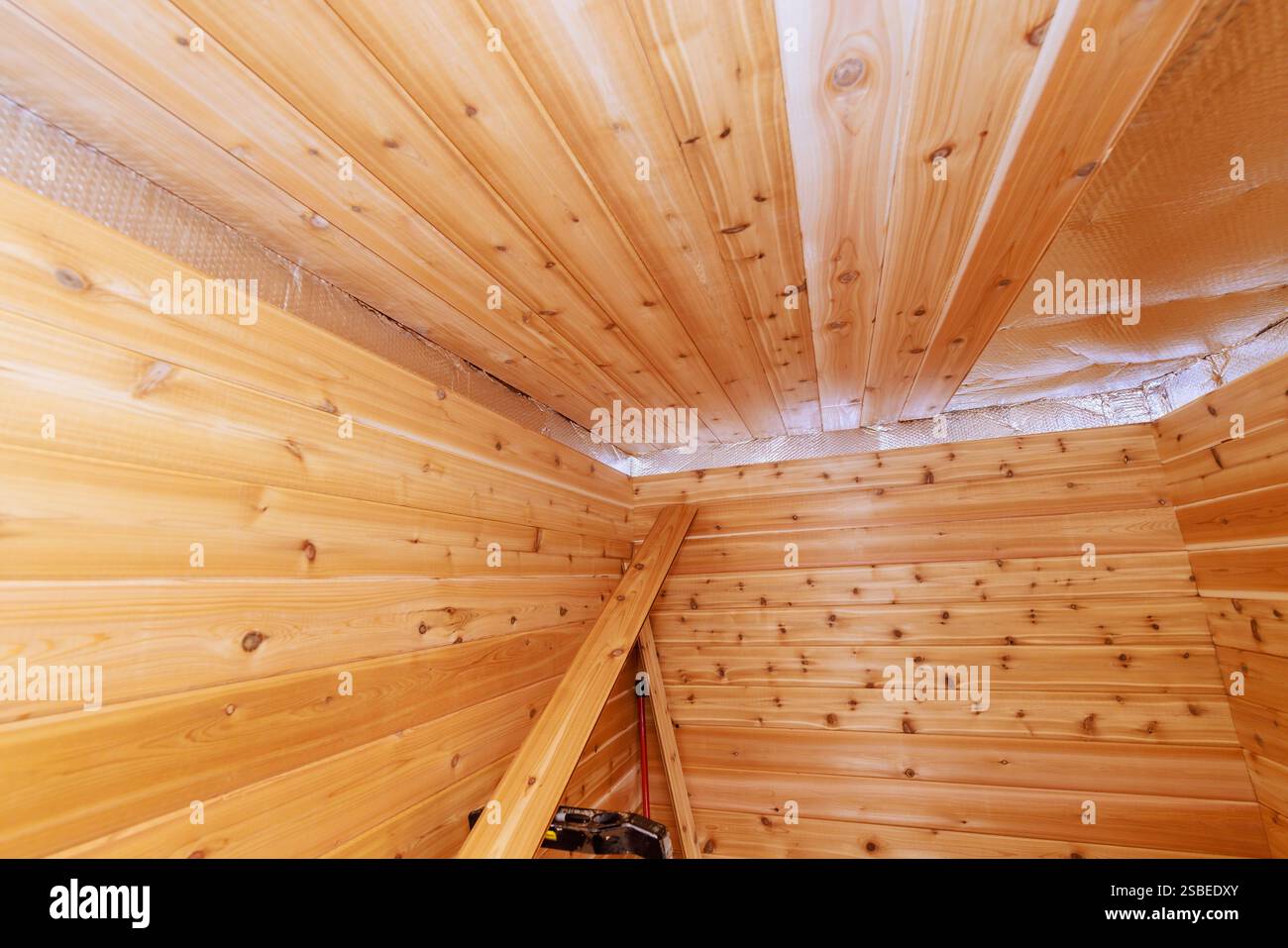 Warm wooden ceiling features beams planks in remodeling sauna cabin ...