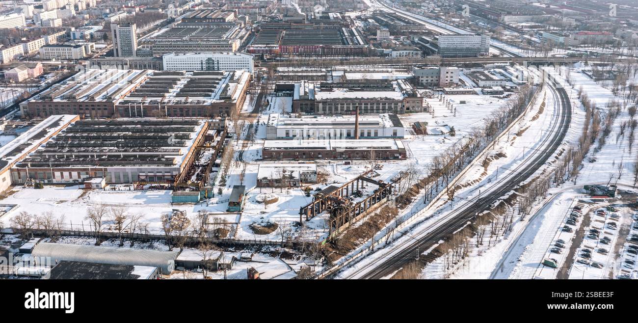 drone photo of city industrial area with factory buildings and ...
