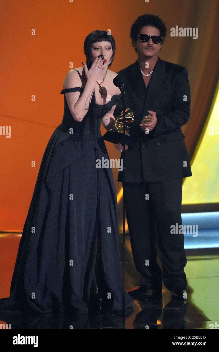 Lady Gaga, left, and Bruno Mars accept the award for best pop duo/group ...