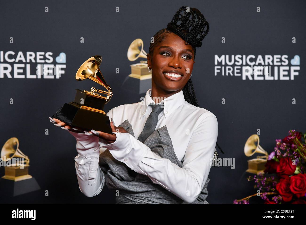 Doechii poses in the press room with the award for best rap album for ...