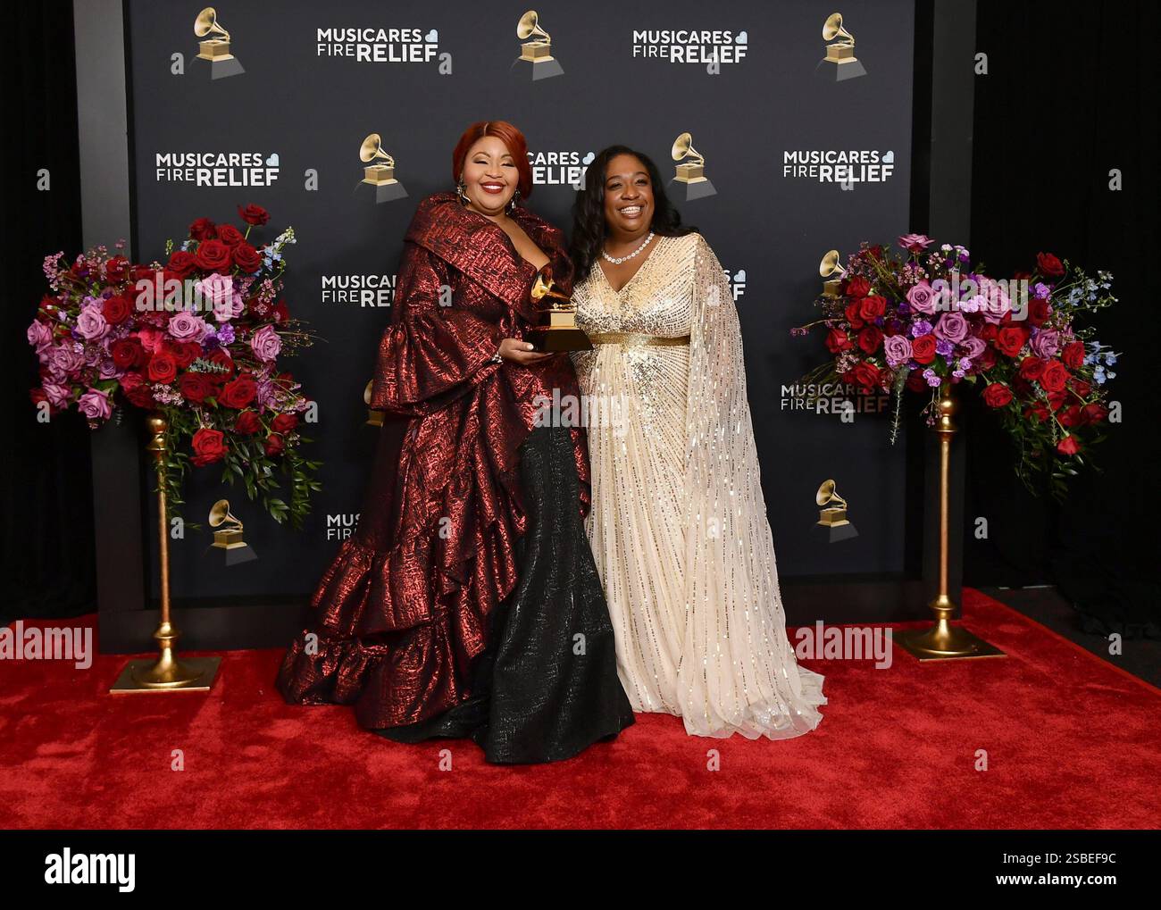 Karen Slack, left, and Michelle Cann pose in the press room with the ...