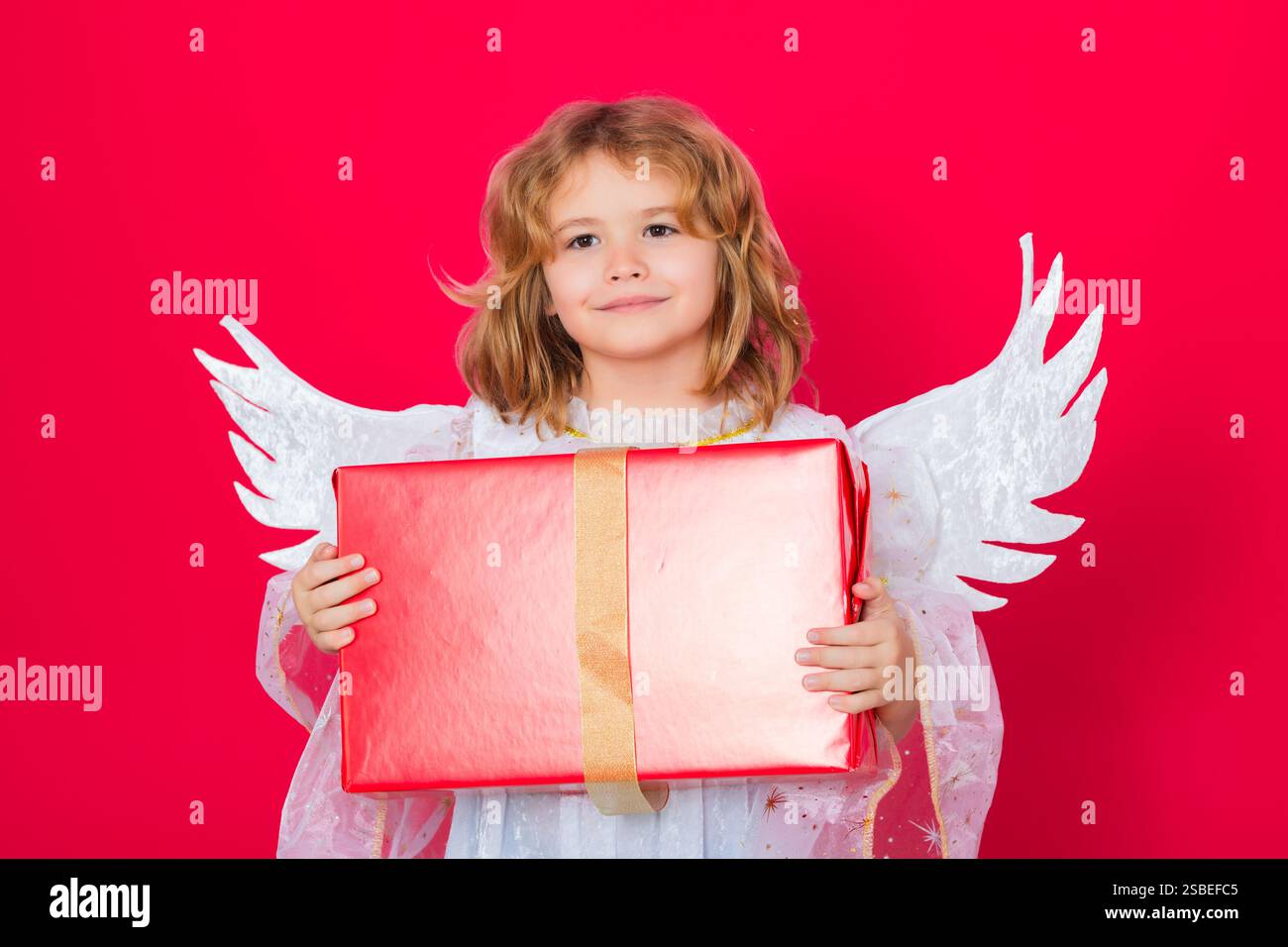 Kid boy angel with gift box present. Kid wearing angel costume white ...