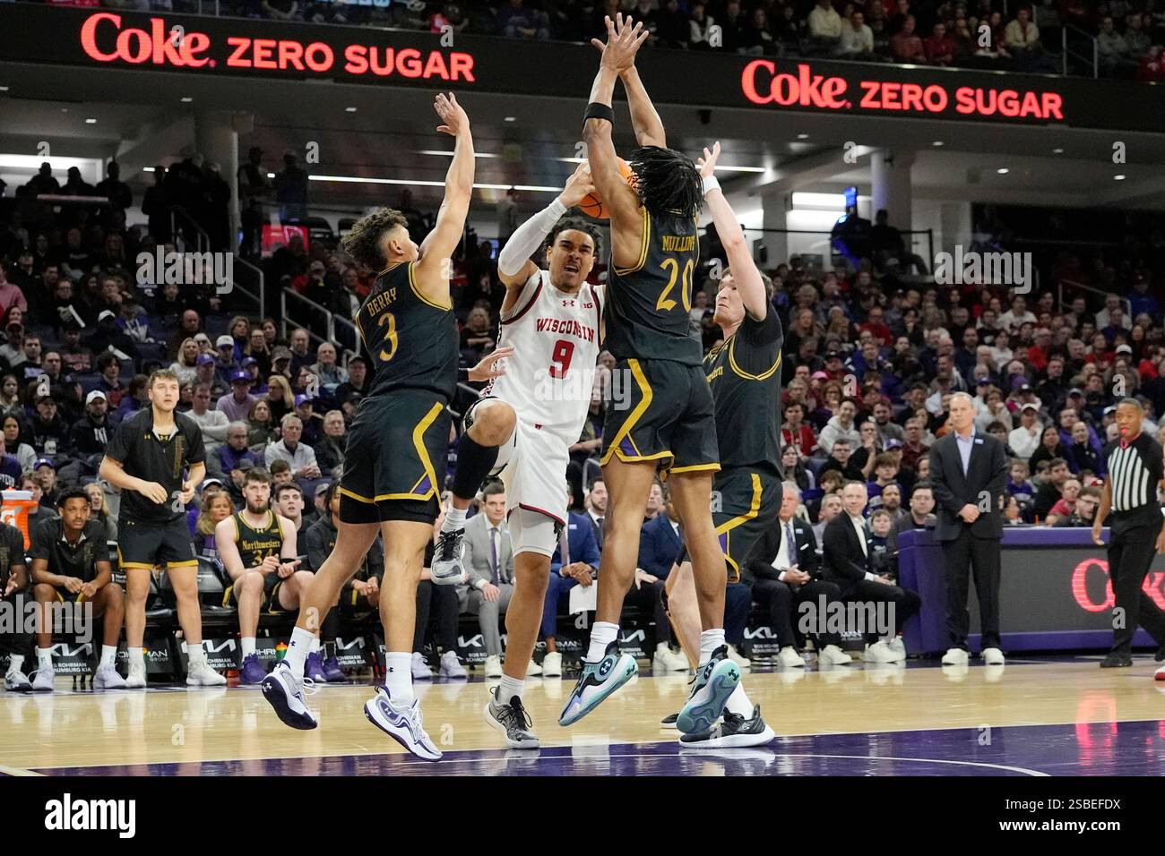 Wisconsin guard John Tonje (9) drives to the basket against ...