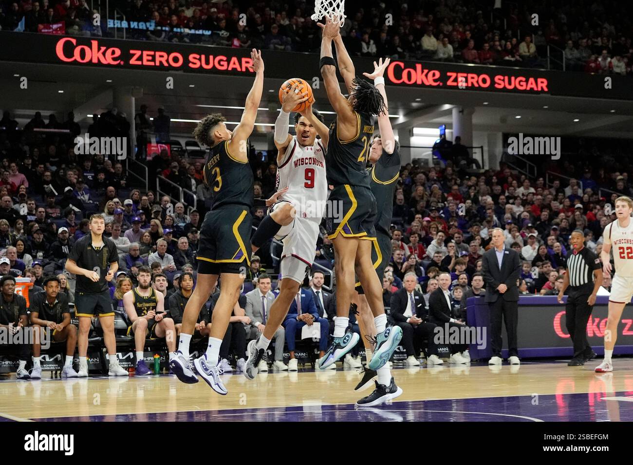 Wisconsin guard John Tonje (9) drives to the basket against ...
