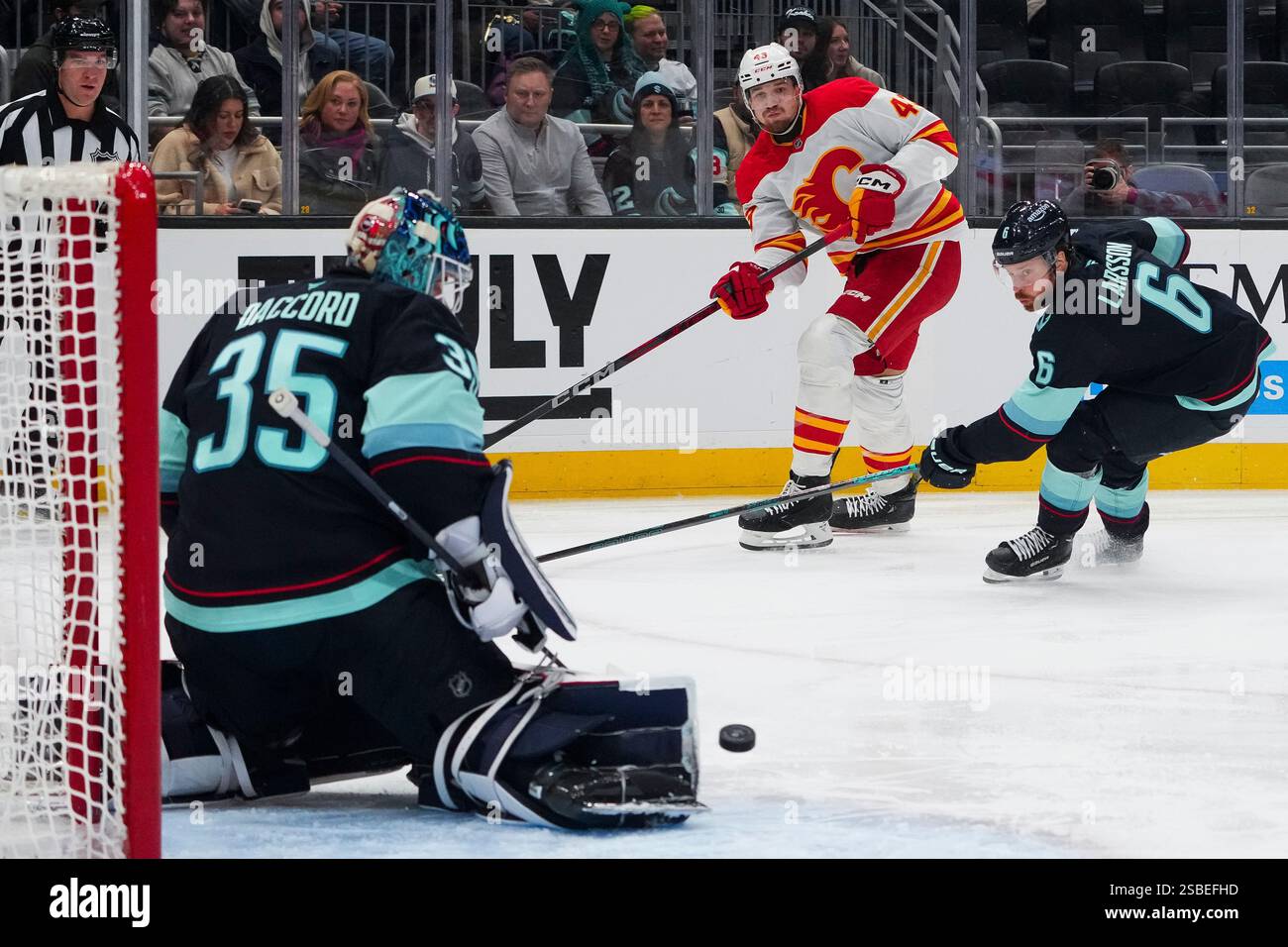 Seattle Kraken goaltender Joey Daccord (35) blocks a shot from Calgary ...